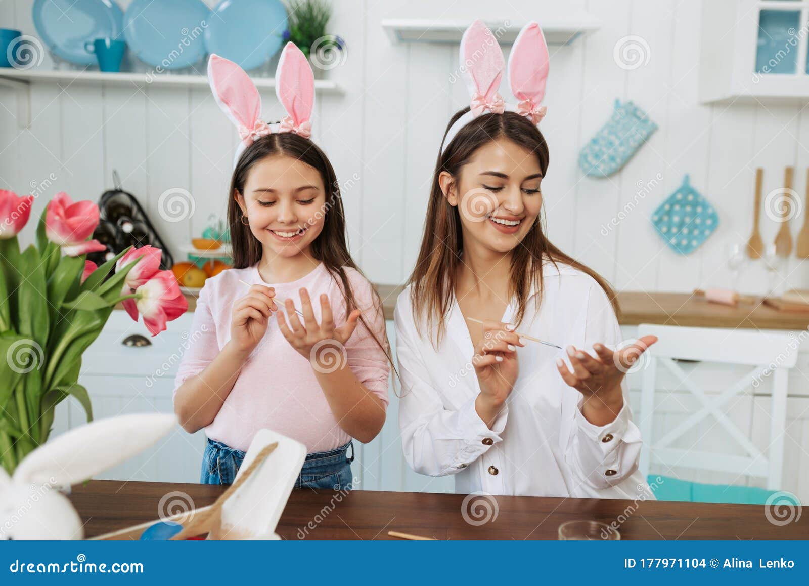 Happy Easter! Mom and Daughter are Having Fun, Painting Hands while ...