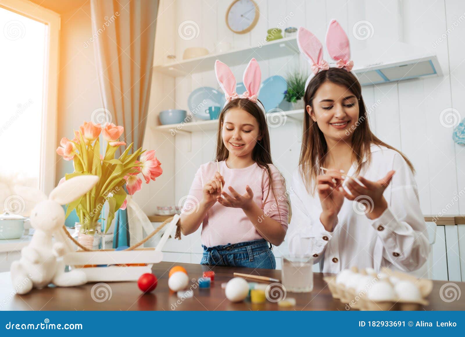 Happy Easter! Mom and Daughter are Having Fun, Painting Hands while ...