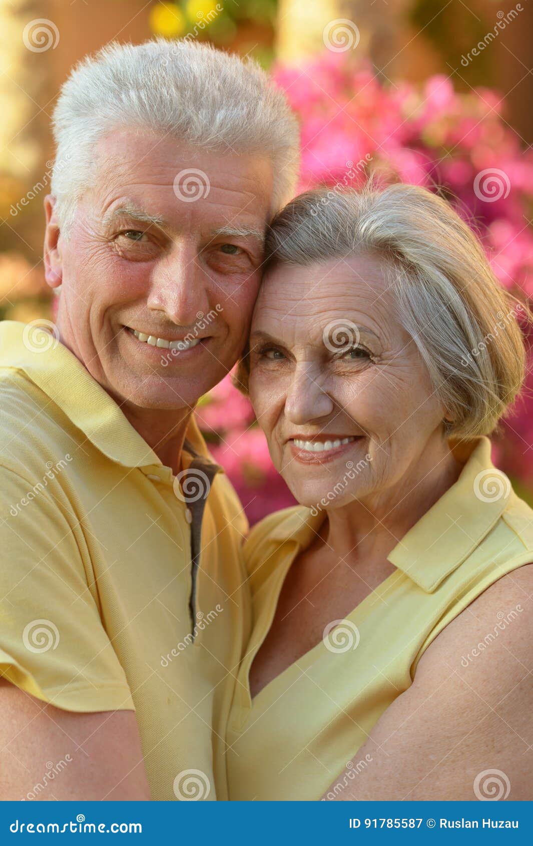 Happy Elderly Couple Embracing Stock Image - Image of looking ...
