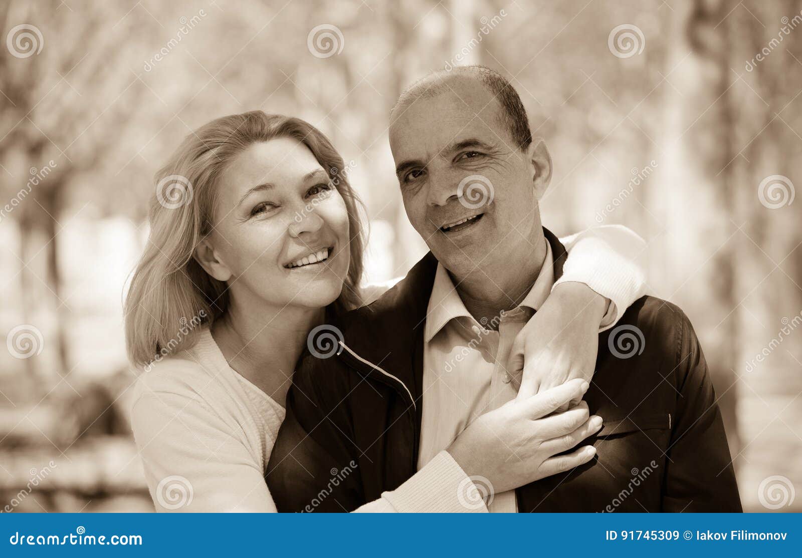 Happy Elderly Couple Smiling in Park and Hug Stock Image - Image of ...
