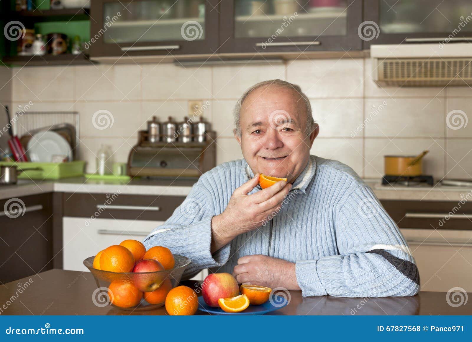 Happy Elderly Man Eating Fruit Stock Photo - Image of fruit, apple ...