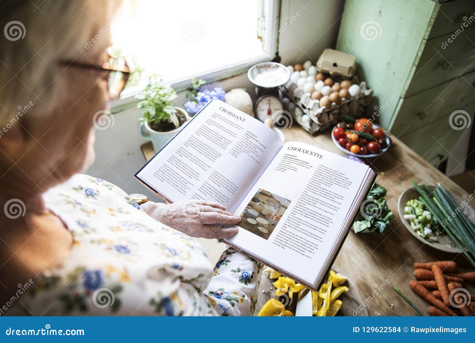 Happy Elderly Woman Reading a Cookbook Stock Photo - Image of preparing ...