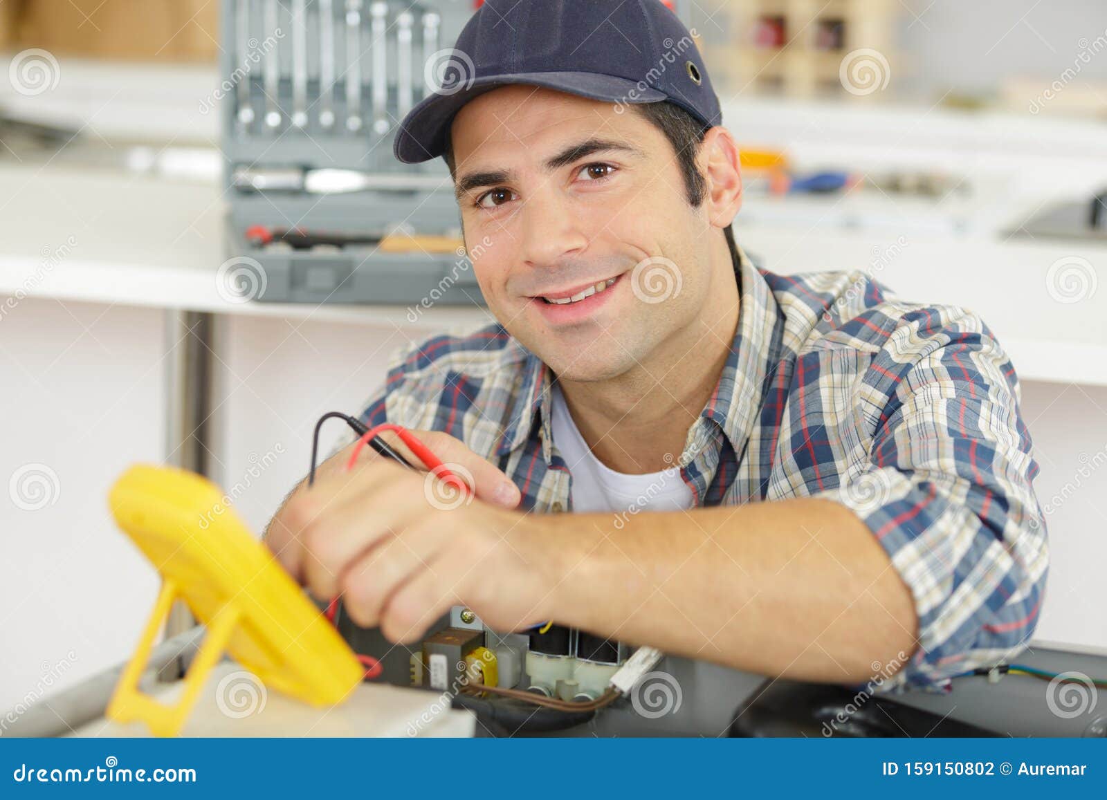 Happy electrician at work stock photo. Image of instrument - 159150802