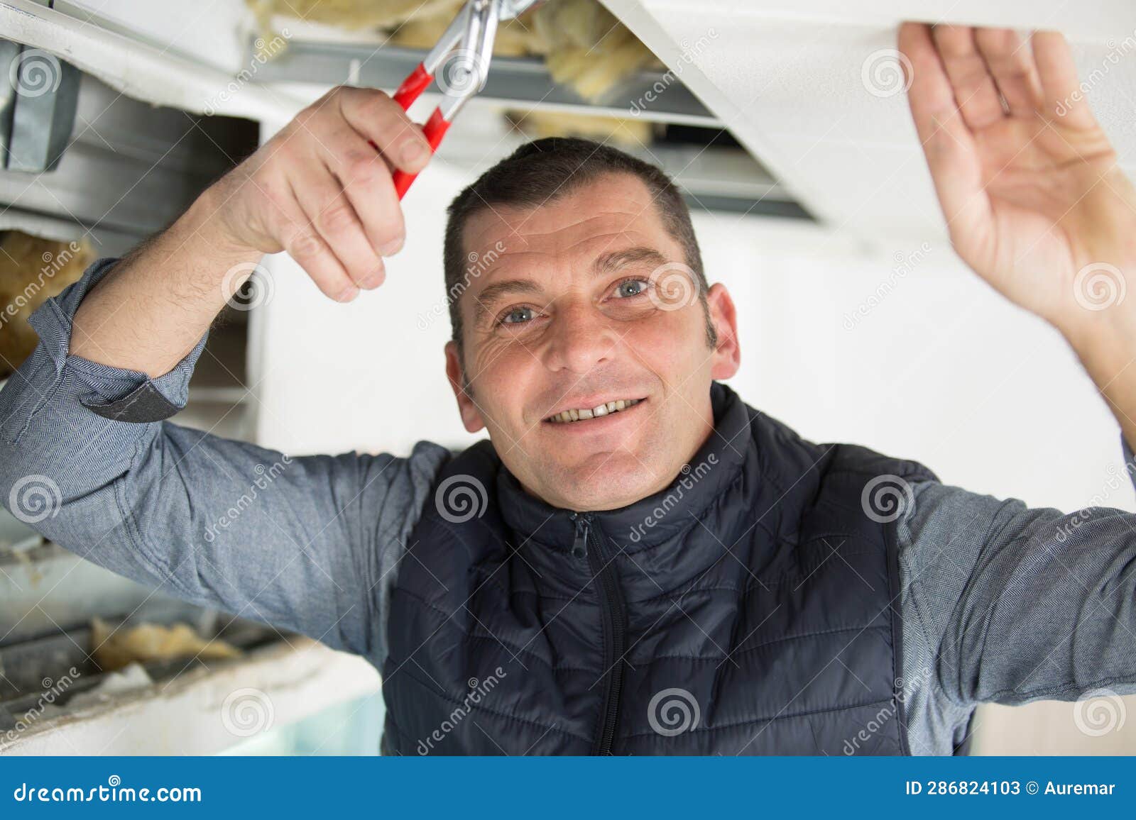 Happy Electrician Worker Fixing Ceiling Stock Image - Image of services ...