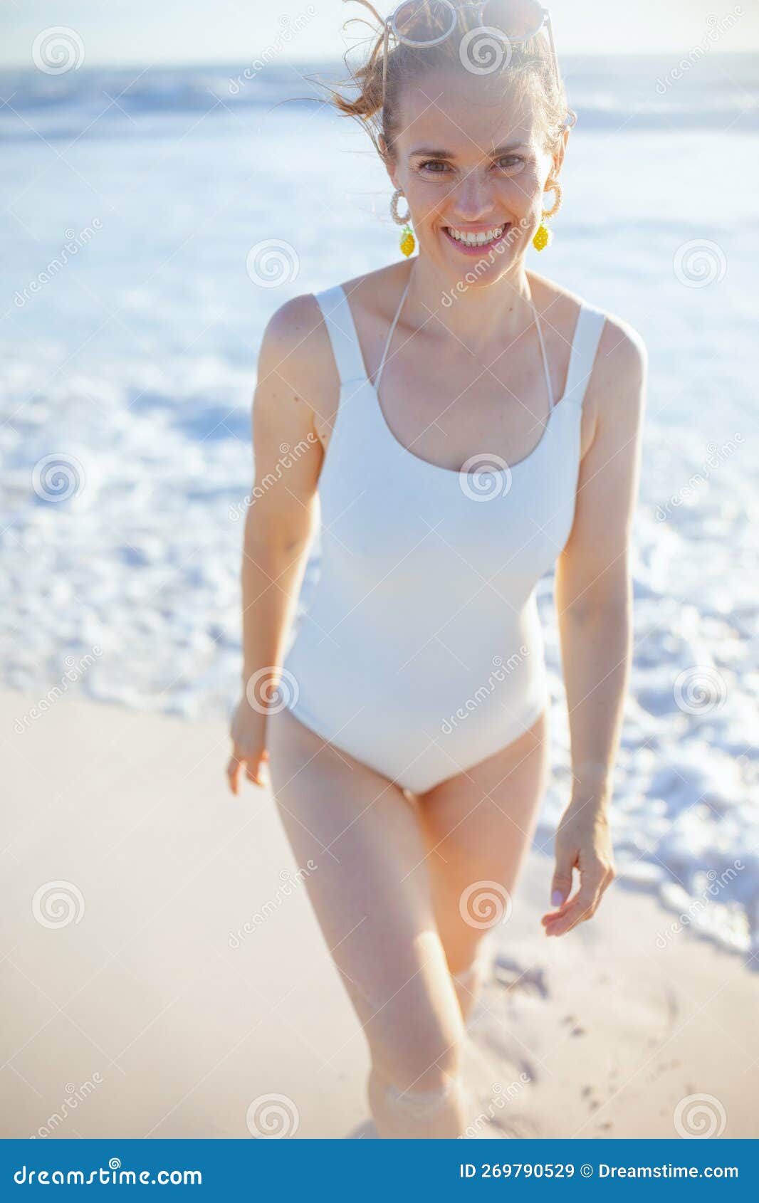 Happy Elegant Woman in White Swimwear at Beach Walking Stock Image ... Happy Elegant Woman in White Swimwear at Beach Walking Stock Image ...