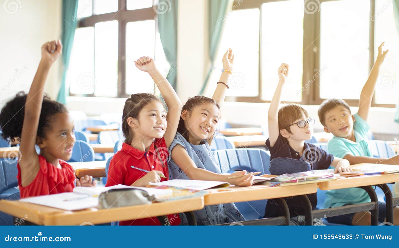 Elementary School Kids in Classroom Stock Image - Image of group, desk ...