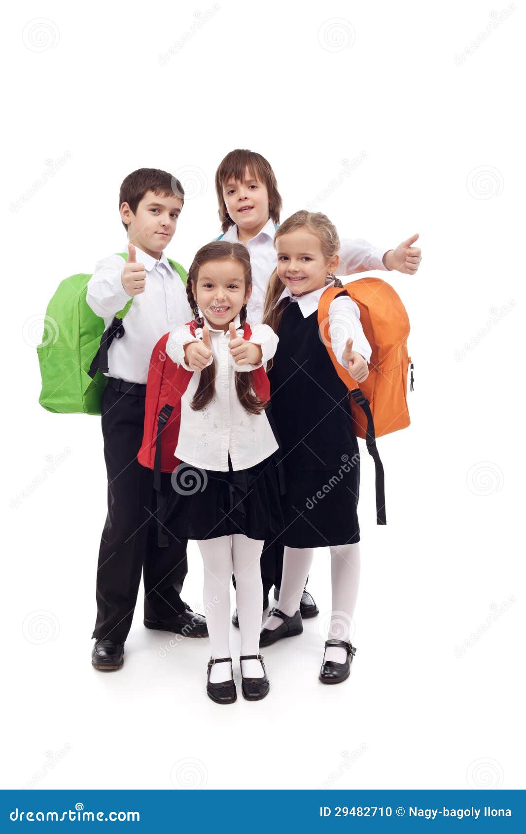 Happy Elementary School Girl Student In Eyeglasses Sitting At Desk And ...