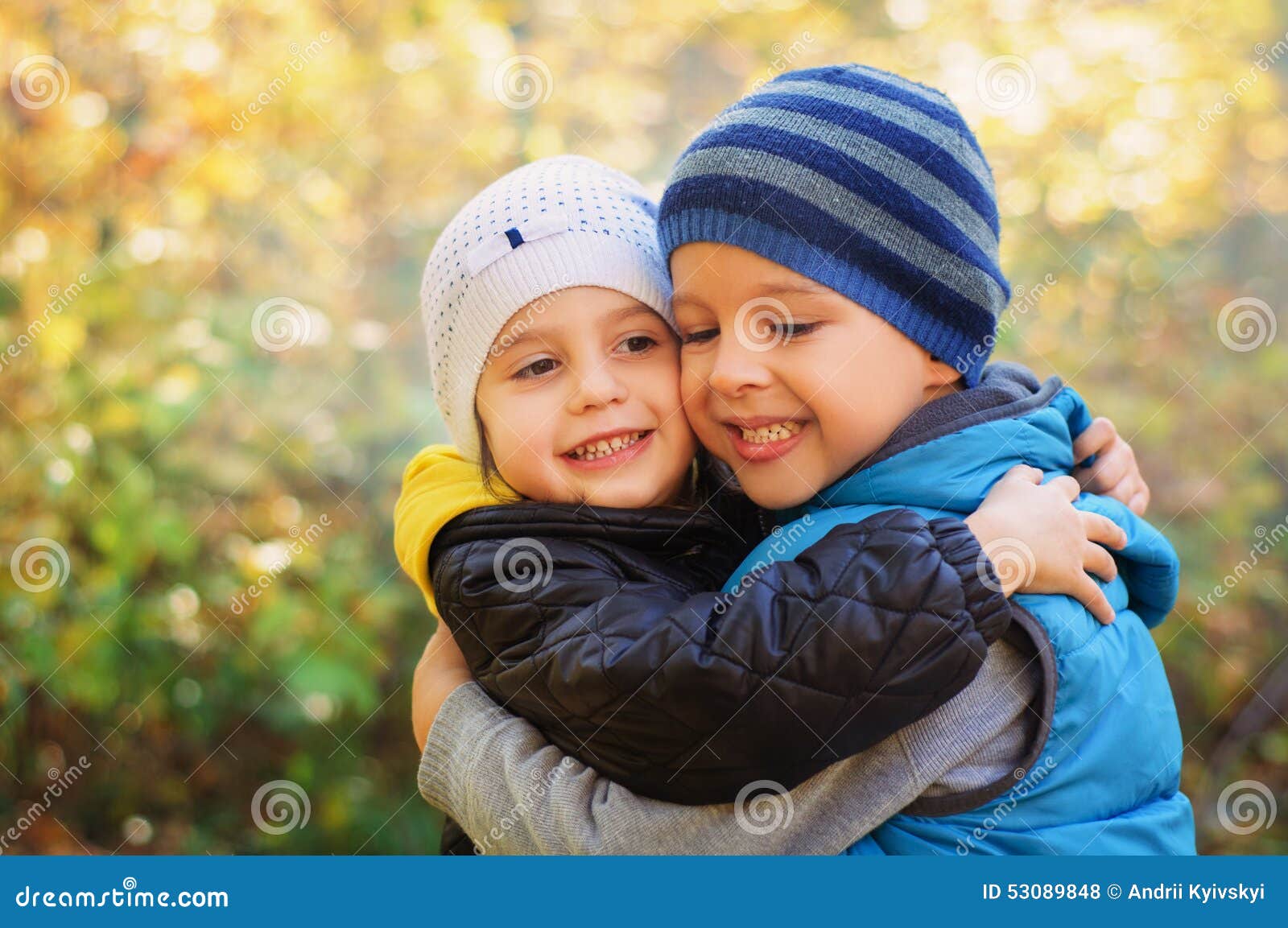 Happy embracing children stock photo. Image of tenderness - 53089848