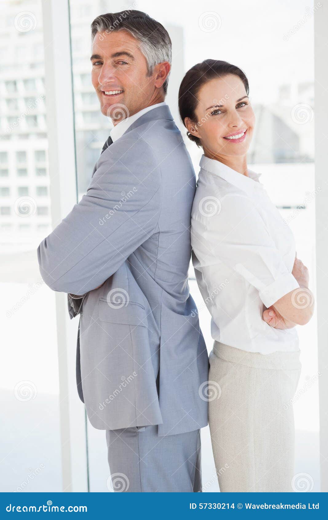 Happy Employees Standing Back To Back Stock Photo - Image of ...