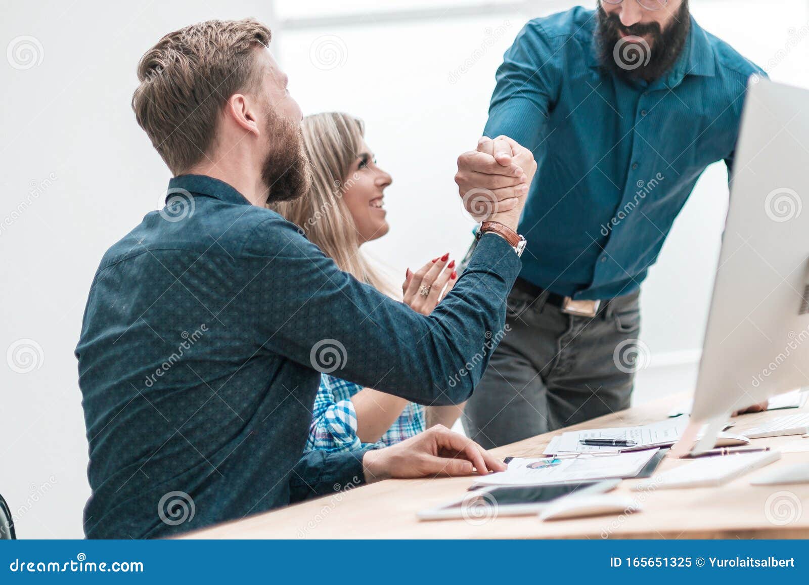 Happy Employees Supporting Each Other with Their Handshake Stock Image ...