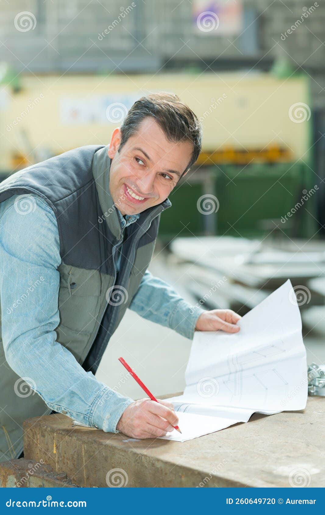 Happy Engineer with Plan Looking at Blueprint Stock Photo - Image of ...