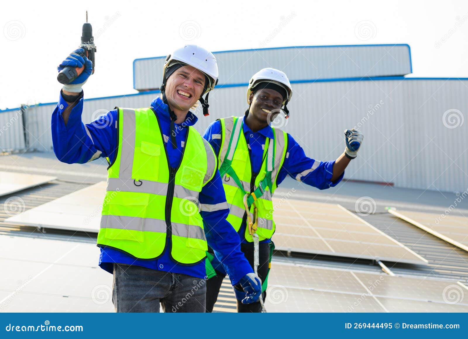 Happy Engineers Technicians Installing Solar Panels on Rooftop of Plant ...