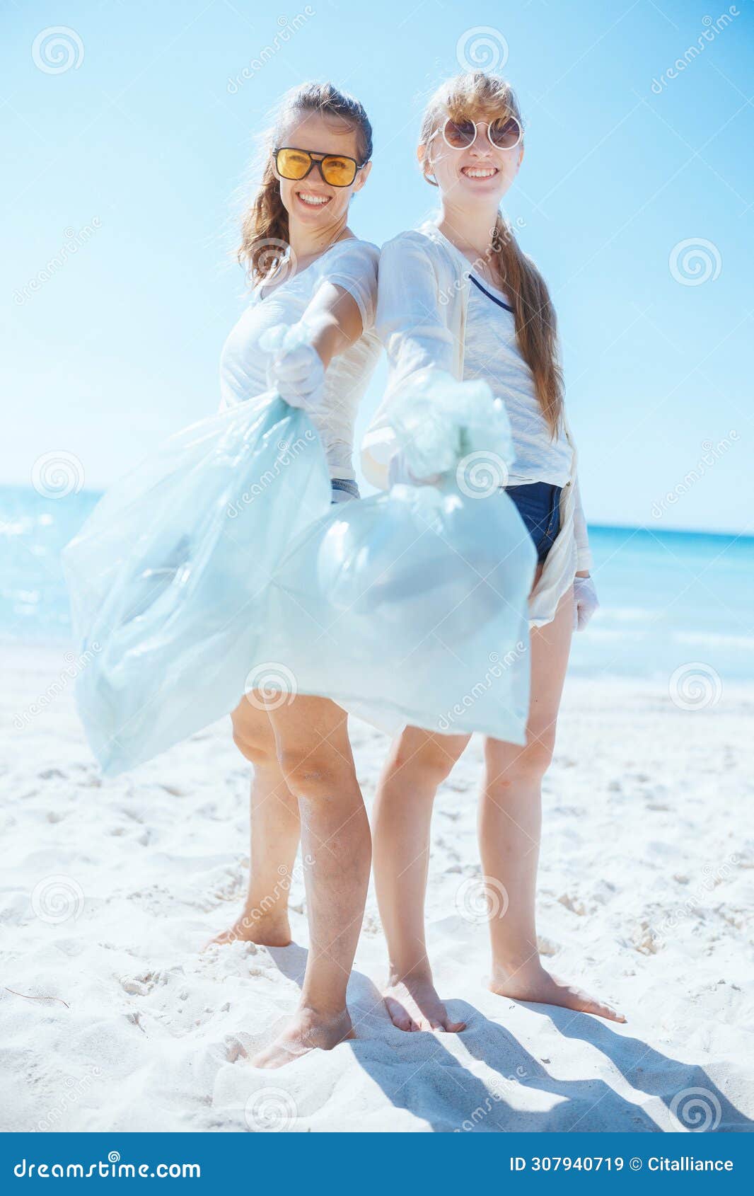 Happy Environment Activists on Beach Collecting Trash Stock Image ...