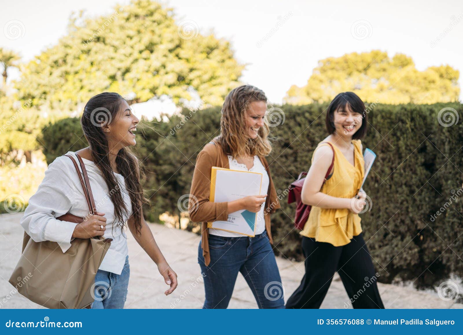 Happy Exchange Students Walking and Chatting on University Campus Stock ...