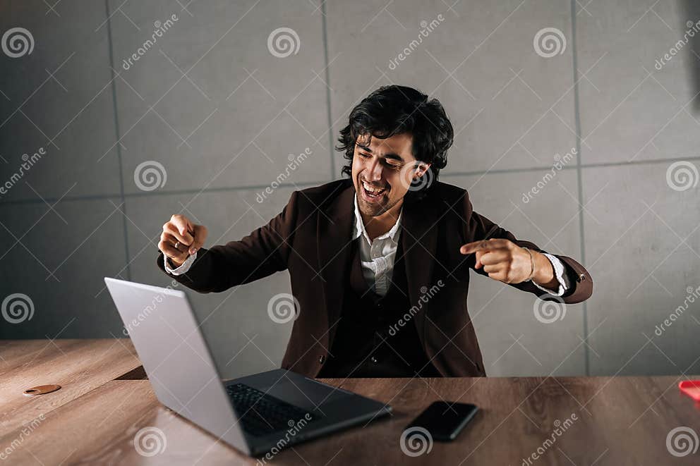 Happy Excited Businessman In Suit Celebrating Business Success