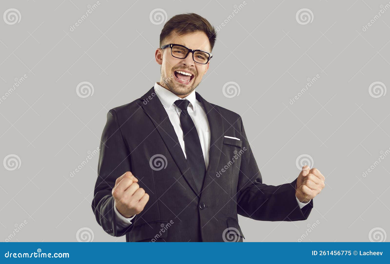 Happy Excited Businessman In Suit And Glasses Celebrating Success And
