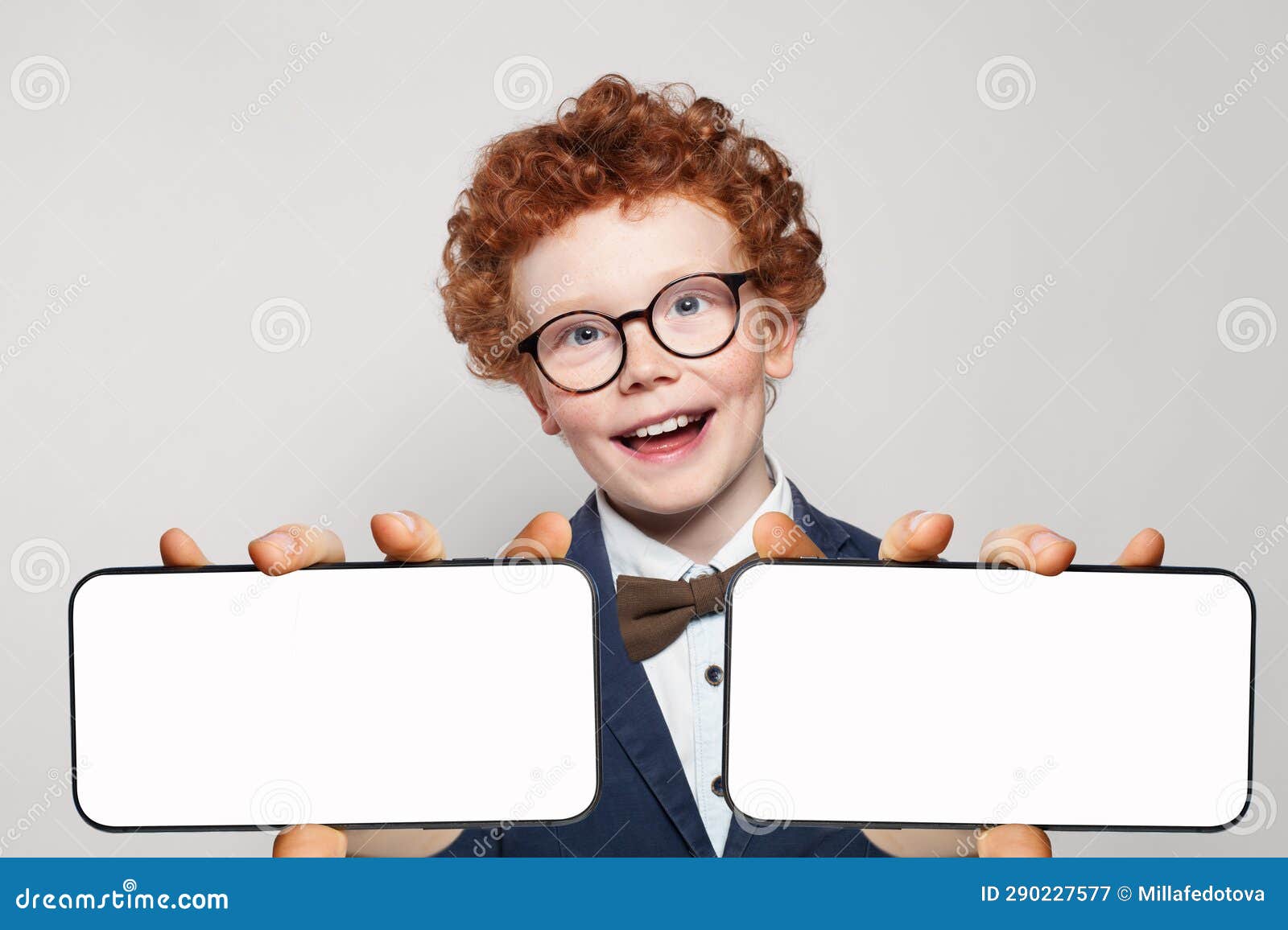 Happy Excited Kid Boy Showing Two Smartphone with Blank Empty White ...