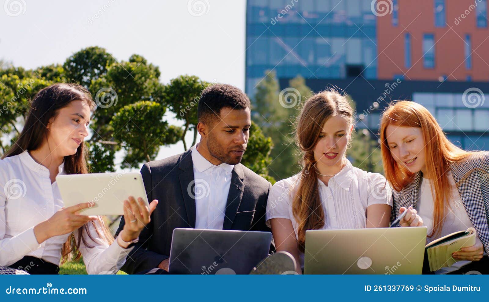 Happy and Excited Students Multiracial Studying Together on the Park in ...