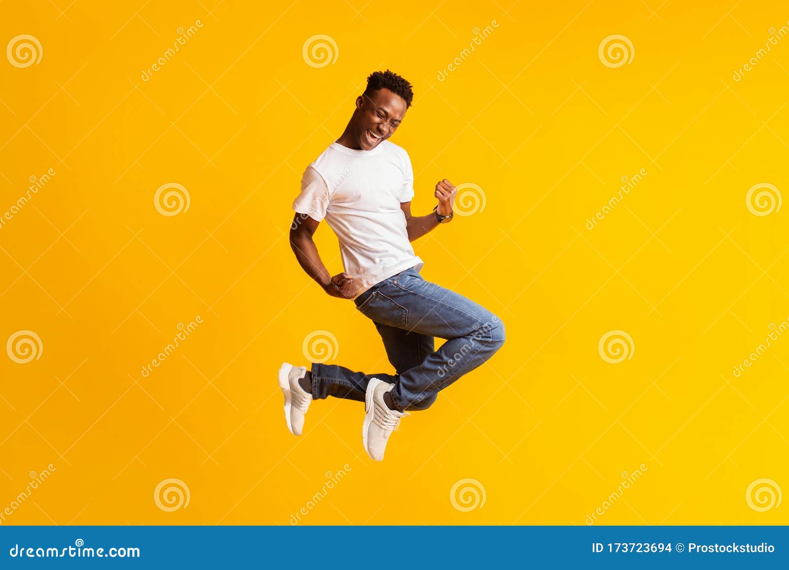 Happy Excited Young Black Man Jumping Over Yellow Stock Photo - Image ... Happy Excited Young Black Man Jumping Over Yellow Stock Photo - Image ...