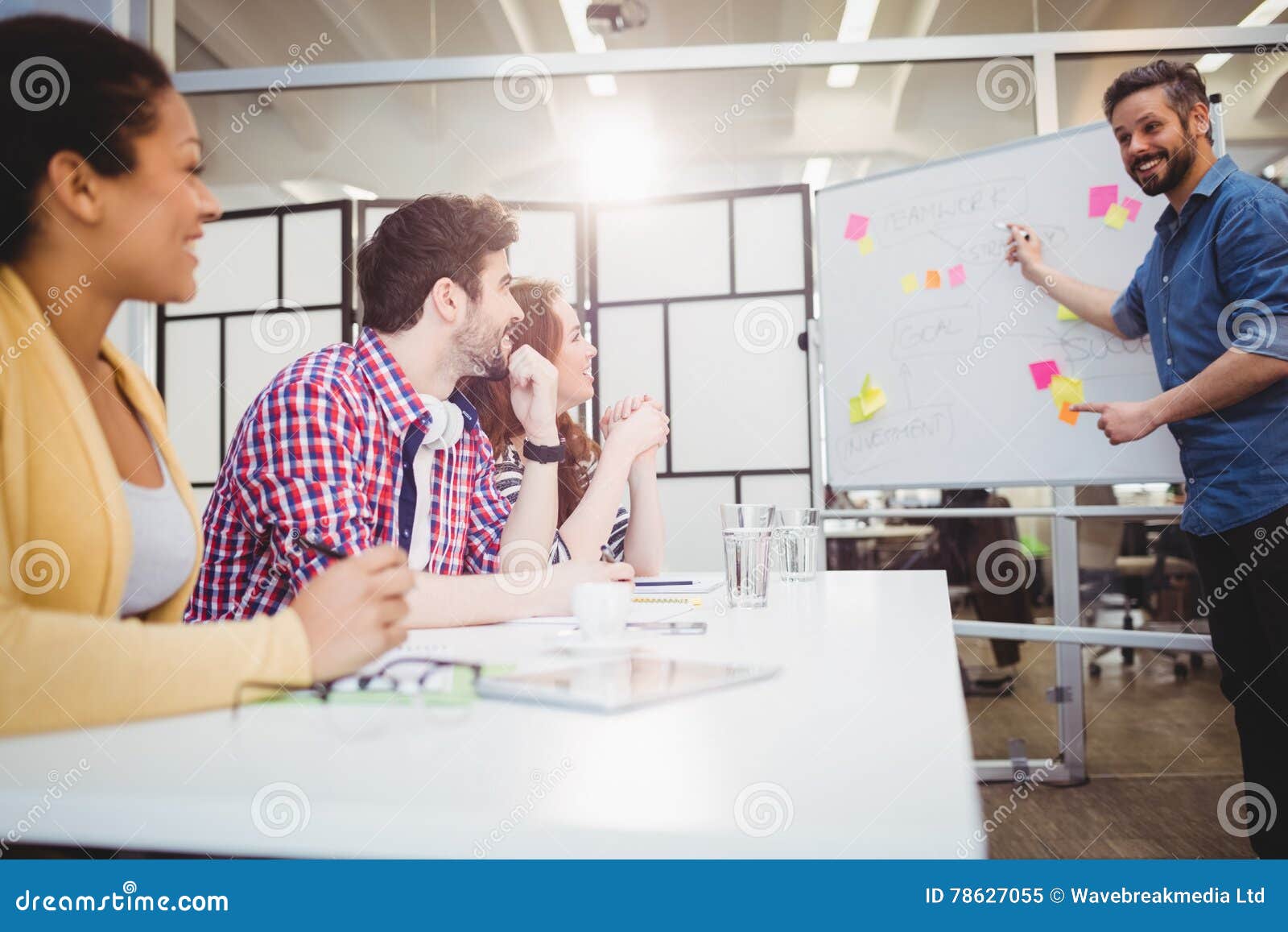 Happy Executive Explaining Colleagues at Creative Office Stock Image ...