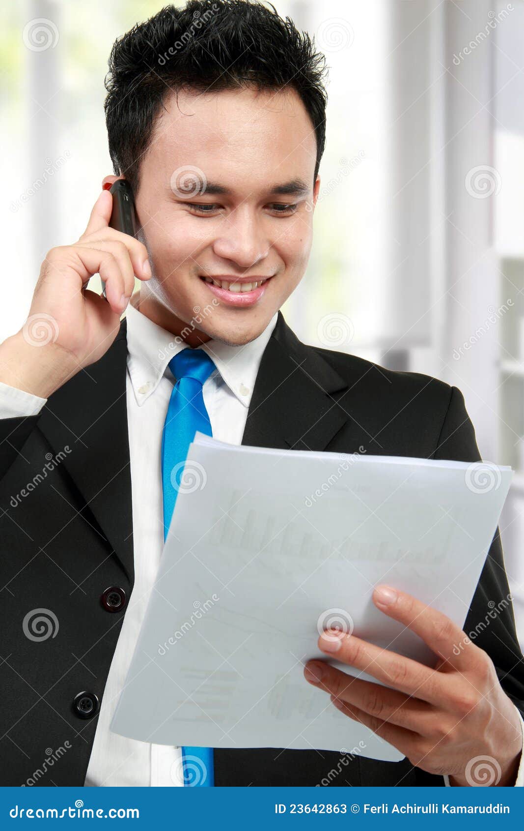 Happy Executive Reading a Report Stock Image - Image of file, phone ...
