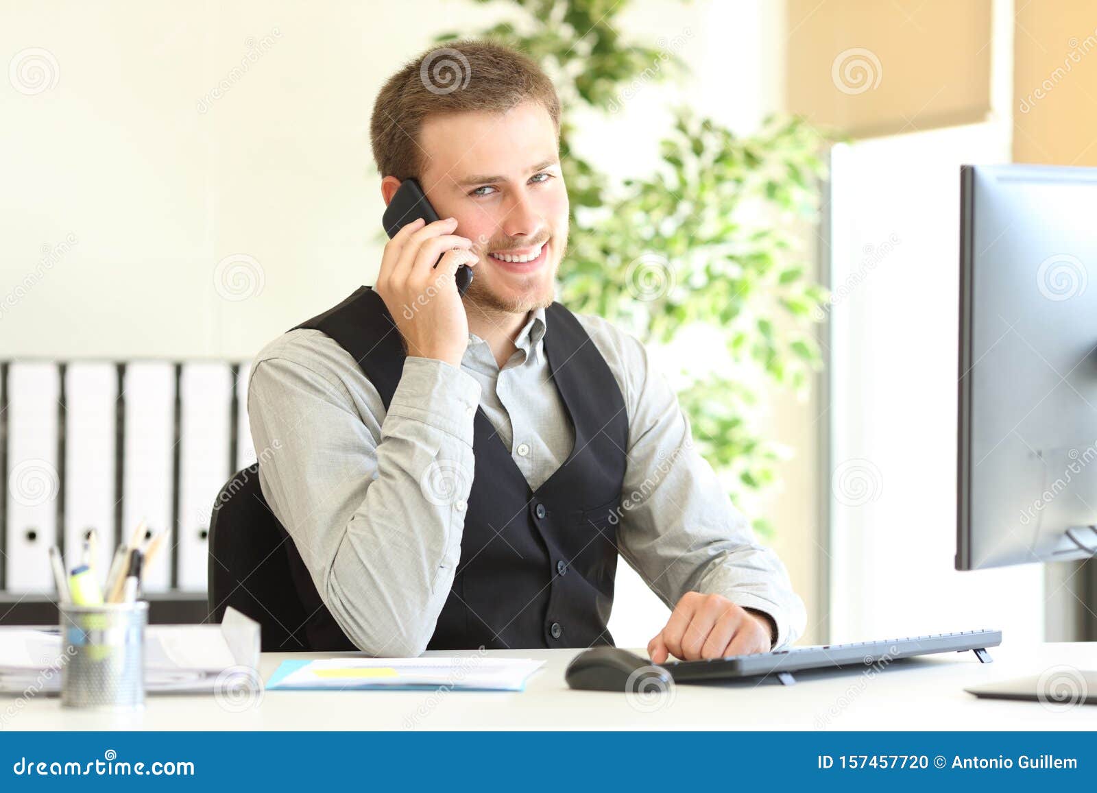 Happy Executive Talking on Phone Looking at Camera Stock Photo - Image ...