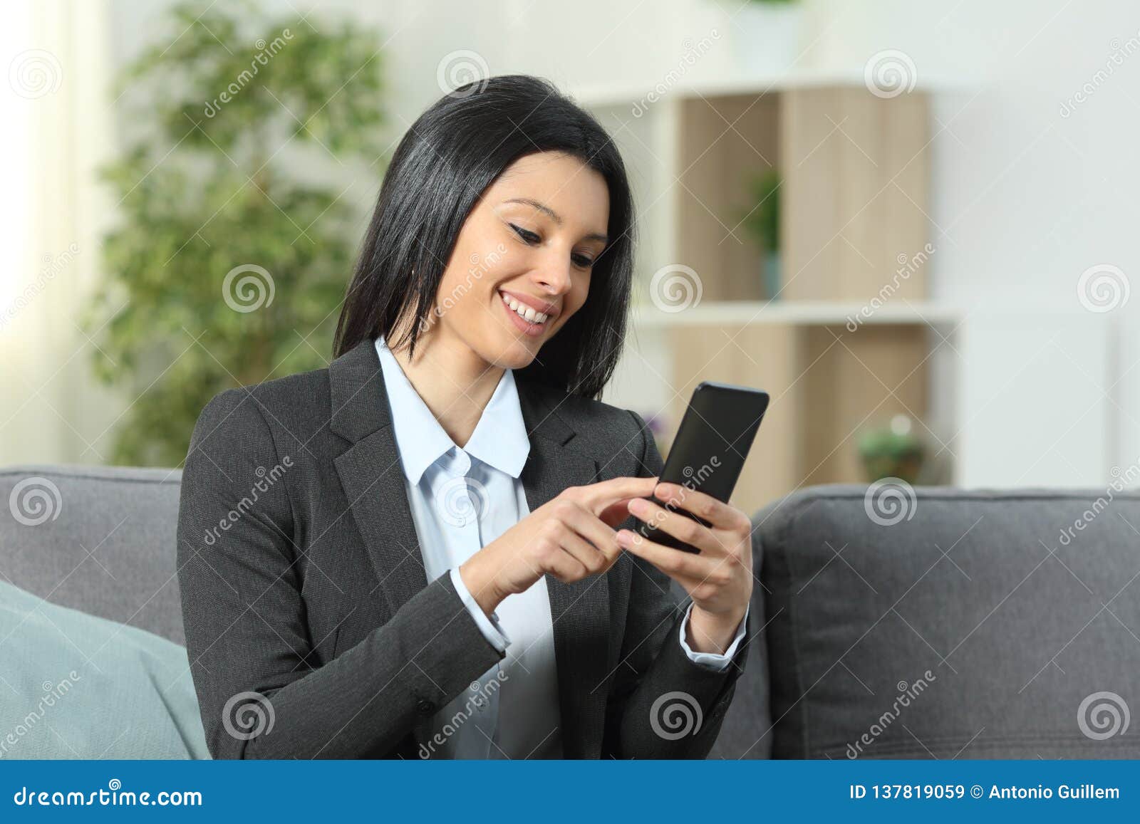 Happy Executive Using a Smart Phone at Home Stock Image - Image of ...