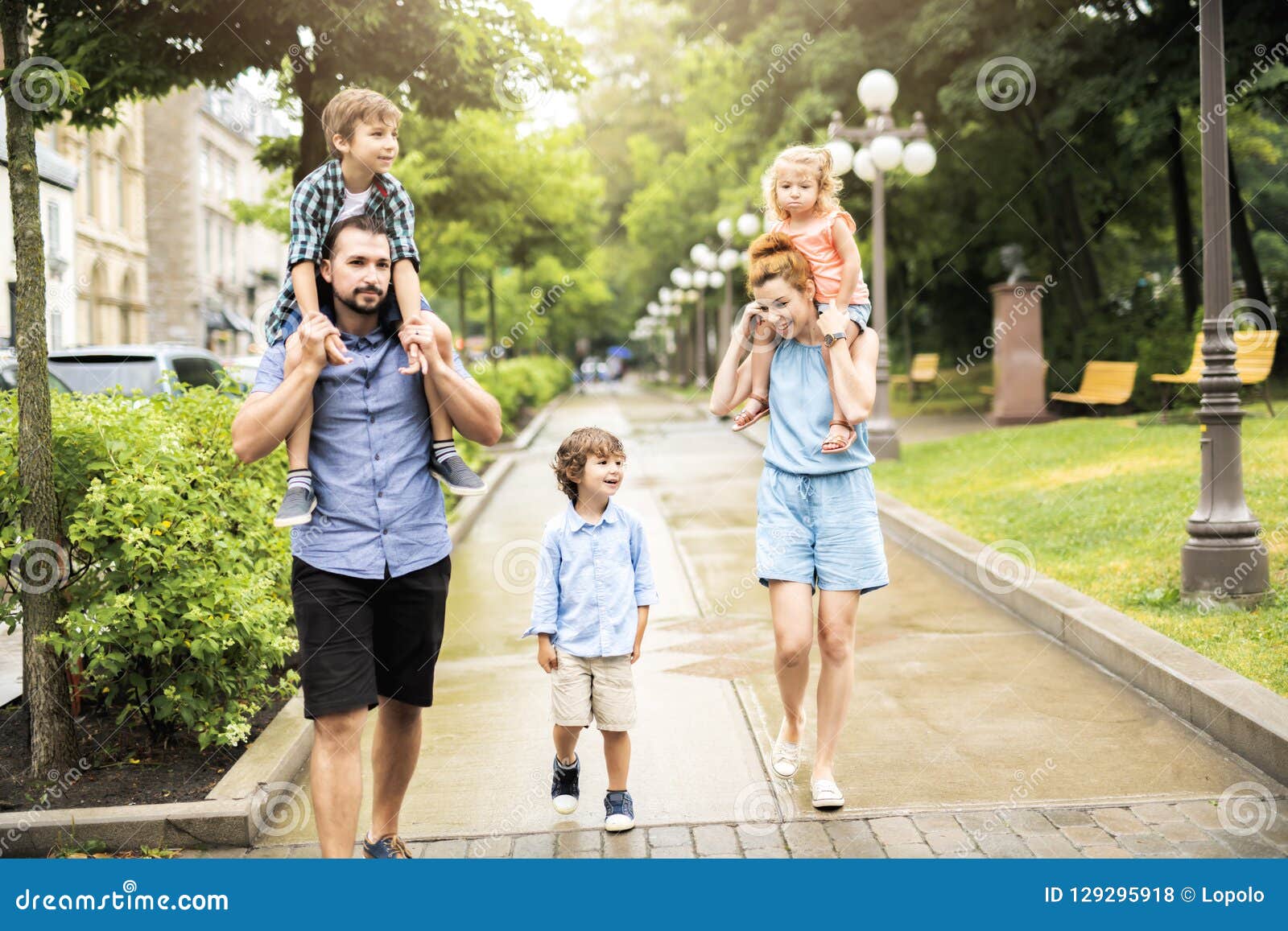 Happy familly in the park stock photo. Image of daughter - 129295918