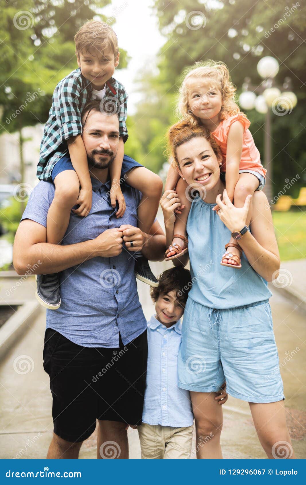 Happy familly in the park stock image. Image of nature - 129296067