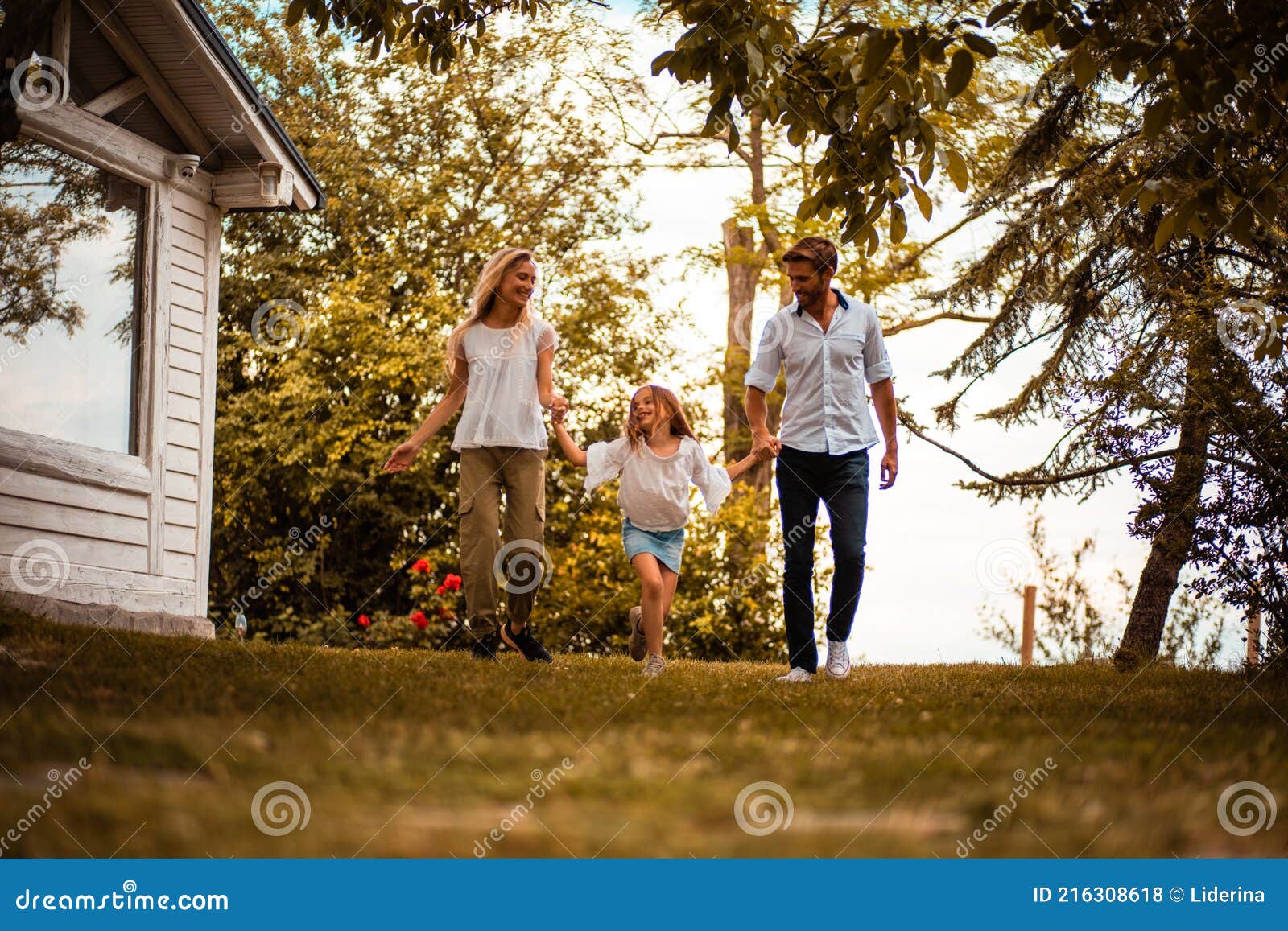 Happy family in backyard stock photo. Image of home - 216308618
