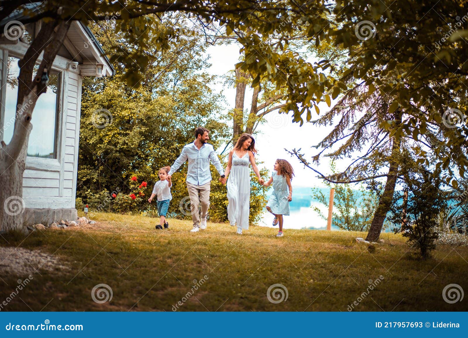 Happy family in backyard stock image. Image of girl - 217957693