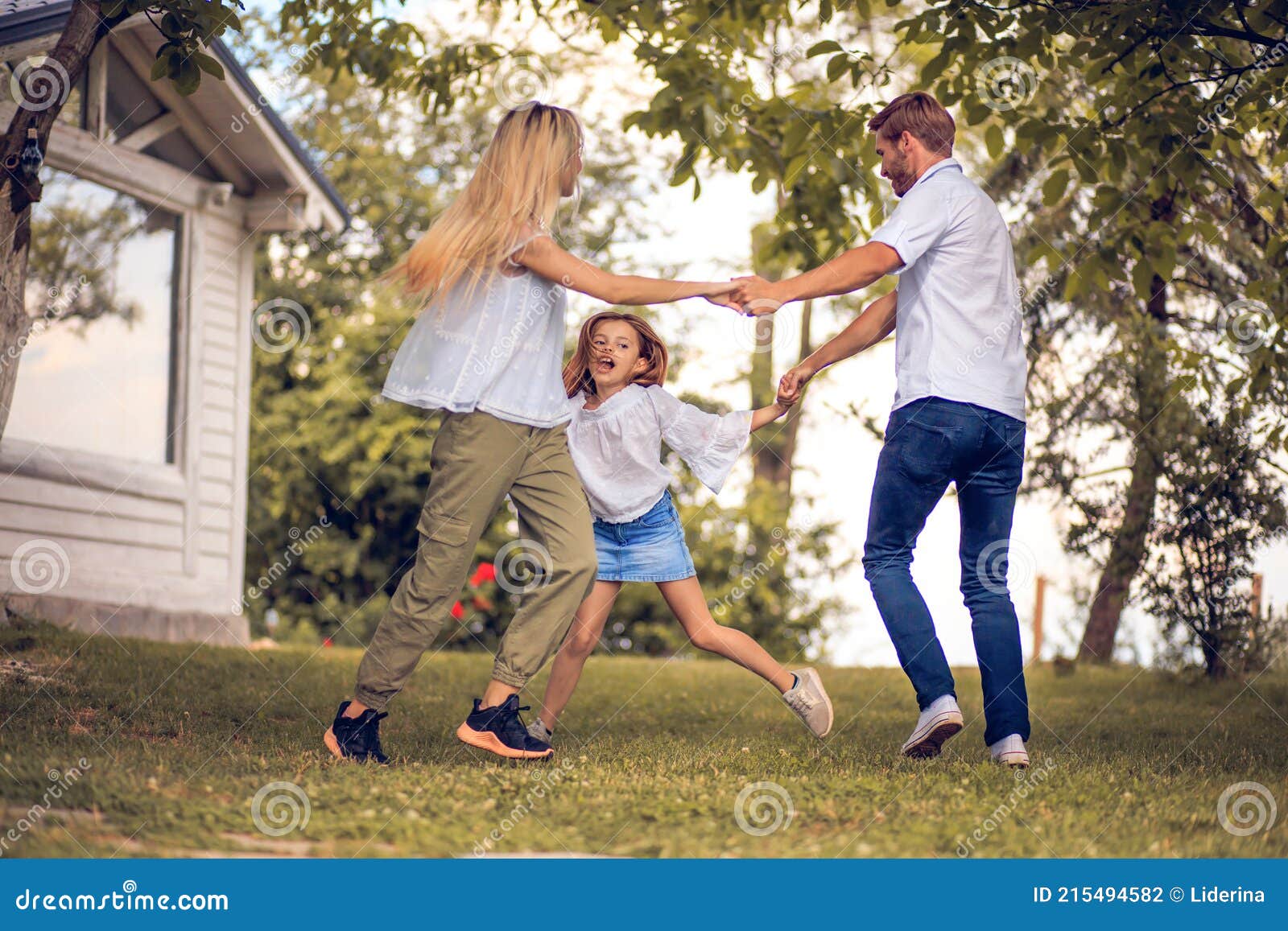Happy family in backyard stock photo. Image of activities - 215494582