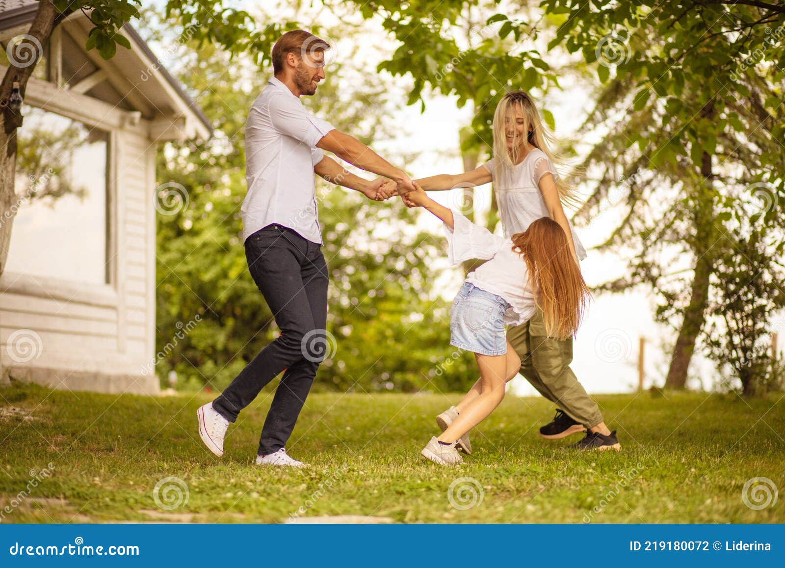 Happy family in backyard stock photo. Image of child - 219180072
