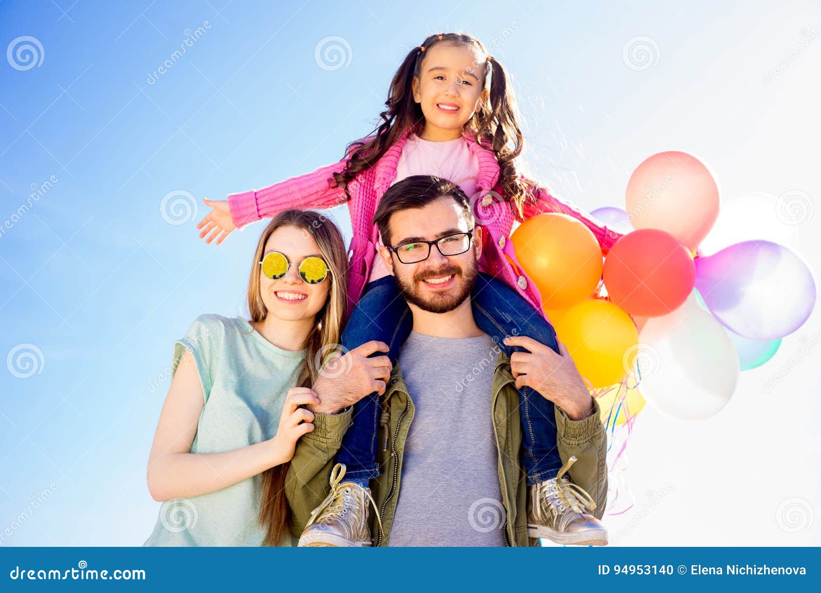 Happy family with balloons stock photo. Image of father - 94953140