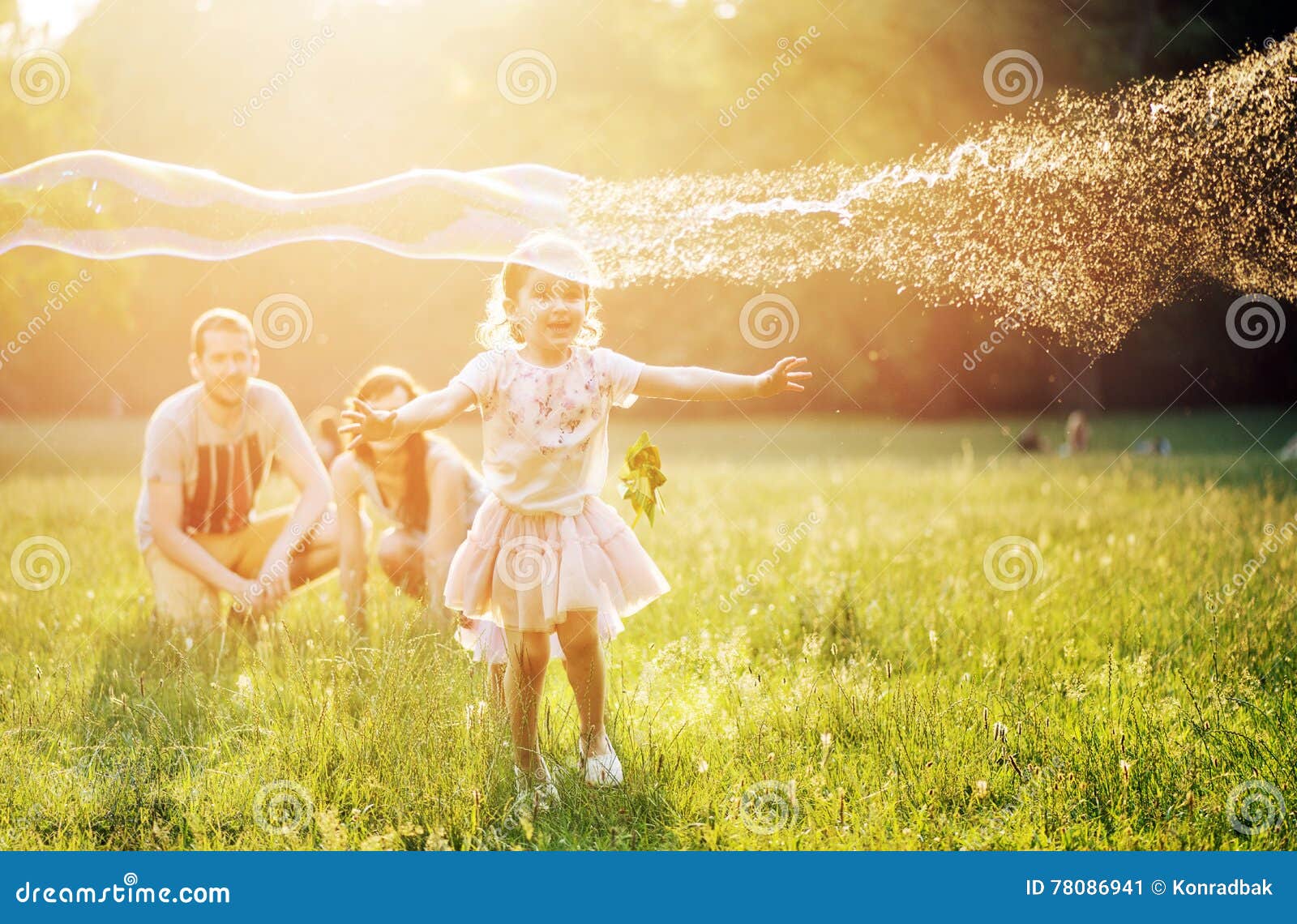 Happy Family Blowing a Bubbles in a Spring Park Stock Image - Image of ...