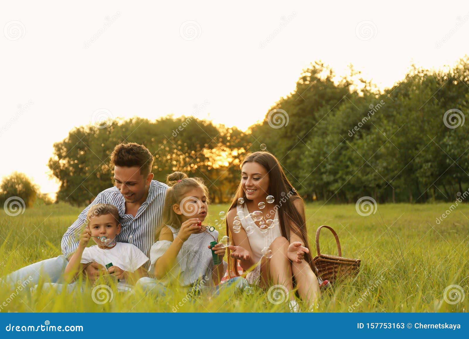 Happy Family Blowing Soap Bubbles in Park at Sunset Stock Image - Image ... Happy Family Blowing Soap Bubbles in Park at Sunset Stock Image - Image ...