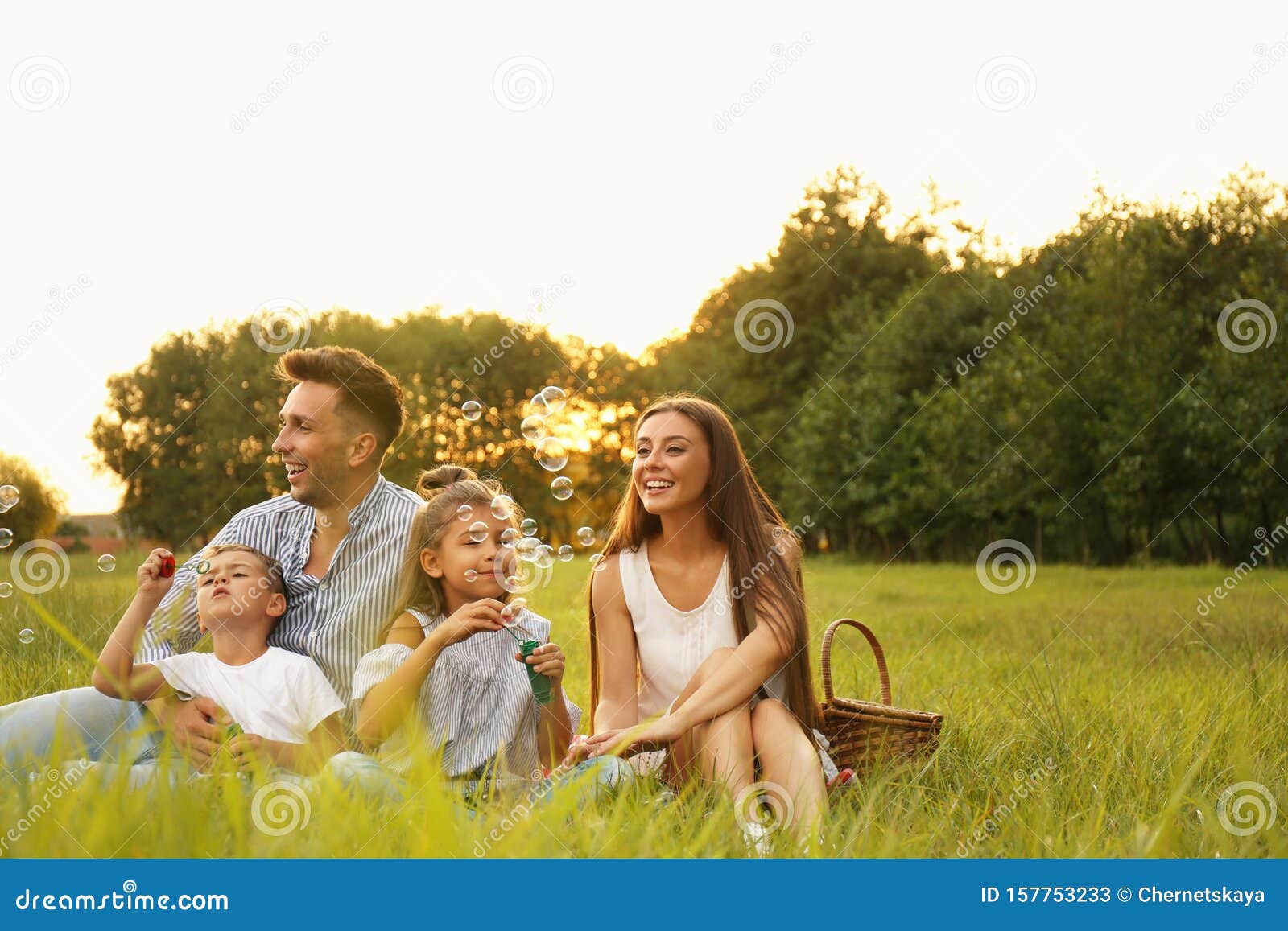 Happy Family Blowing Soap Bubbles in Park at Sunset Stock Image - Image ... Happy Family Blowing Soap Bubbles in Park at Sunset Stock Image - Image ...
