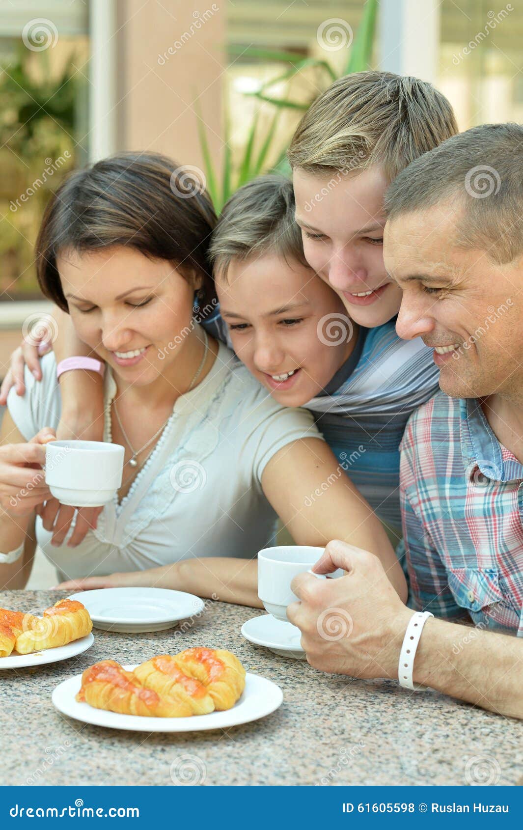 Happy family at breakfast stock photo. Image of boys - 61605598