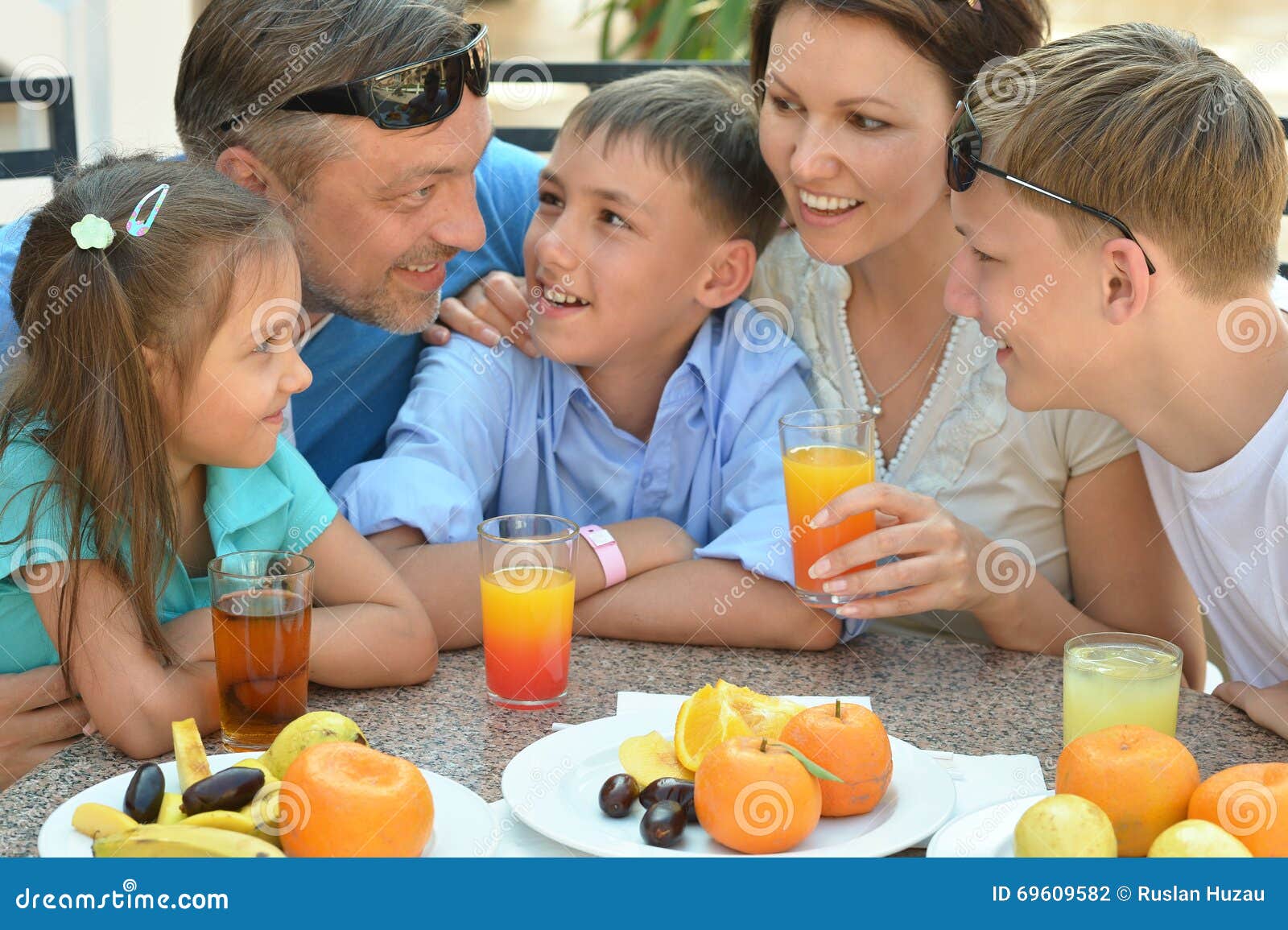 Happy family at breakfast stock photo. Image of father - 69609582