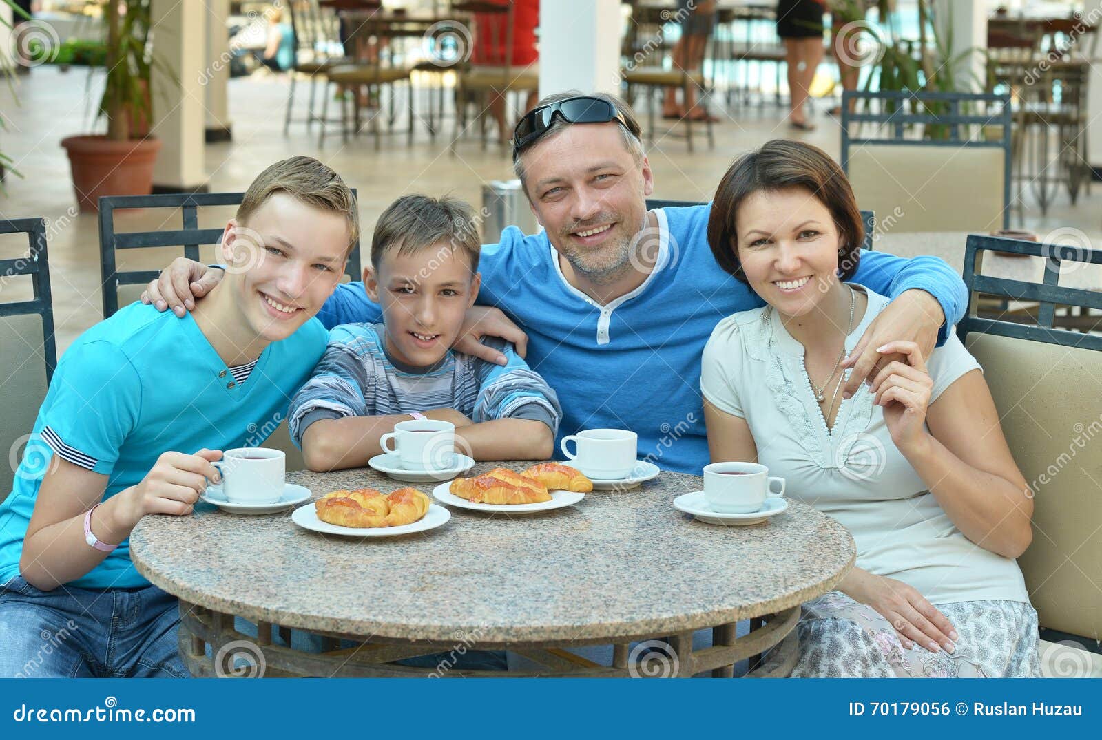Happy family at breakfast stock photo. Image of mother - 70179056