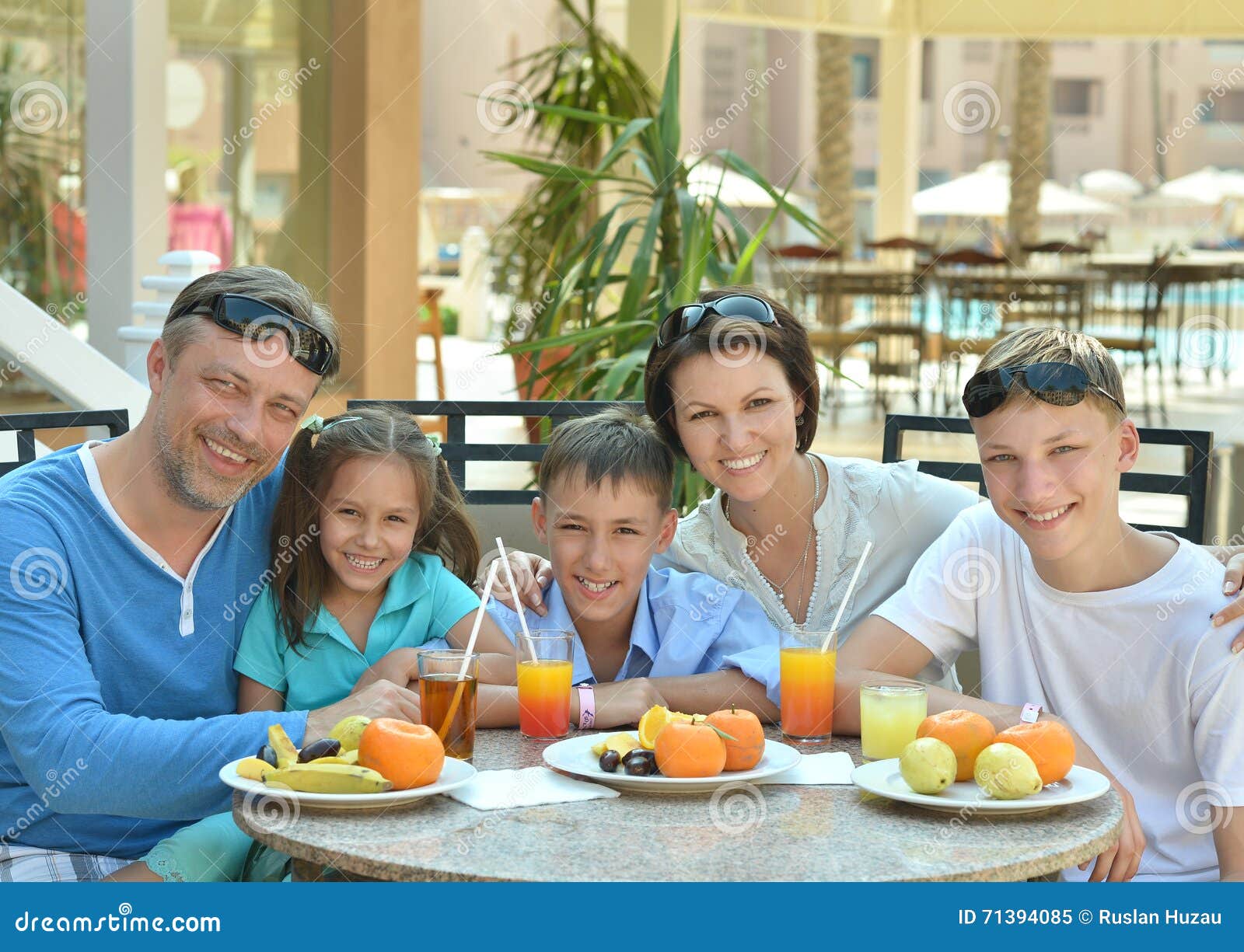 Happy family at breakfast stock image. Image of mother - 71394085