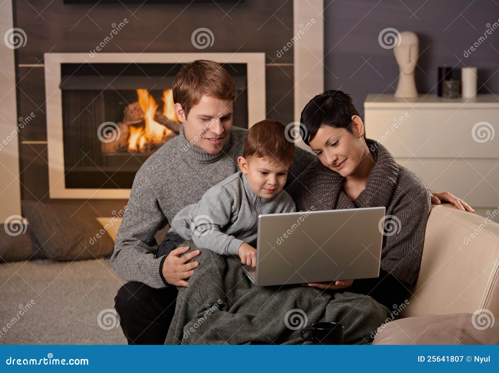 Happy family with computer stock image. Image of apartment - 25641807