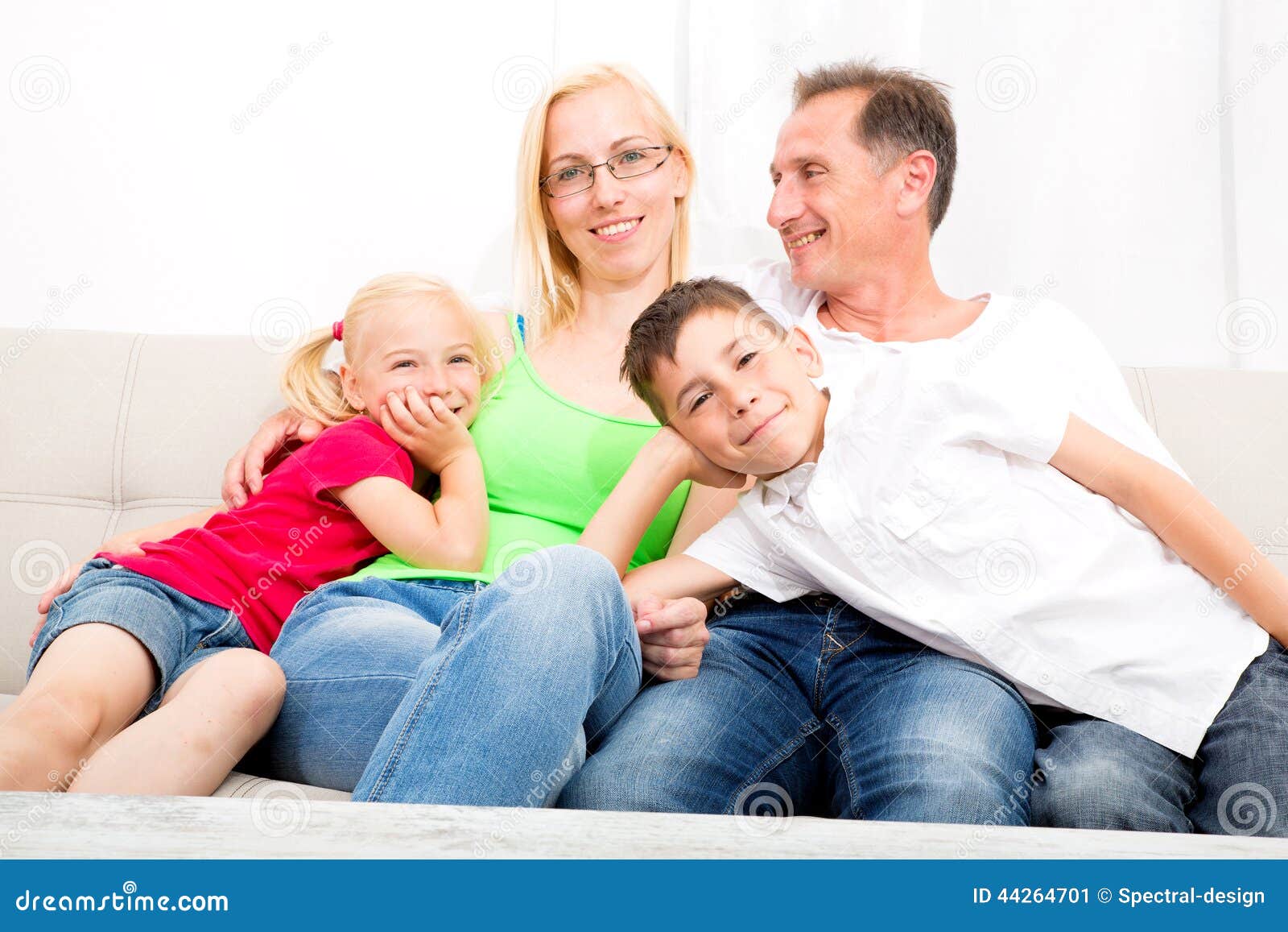 Happy family on the couch stock image. Image of parent - 44264701