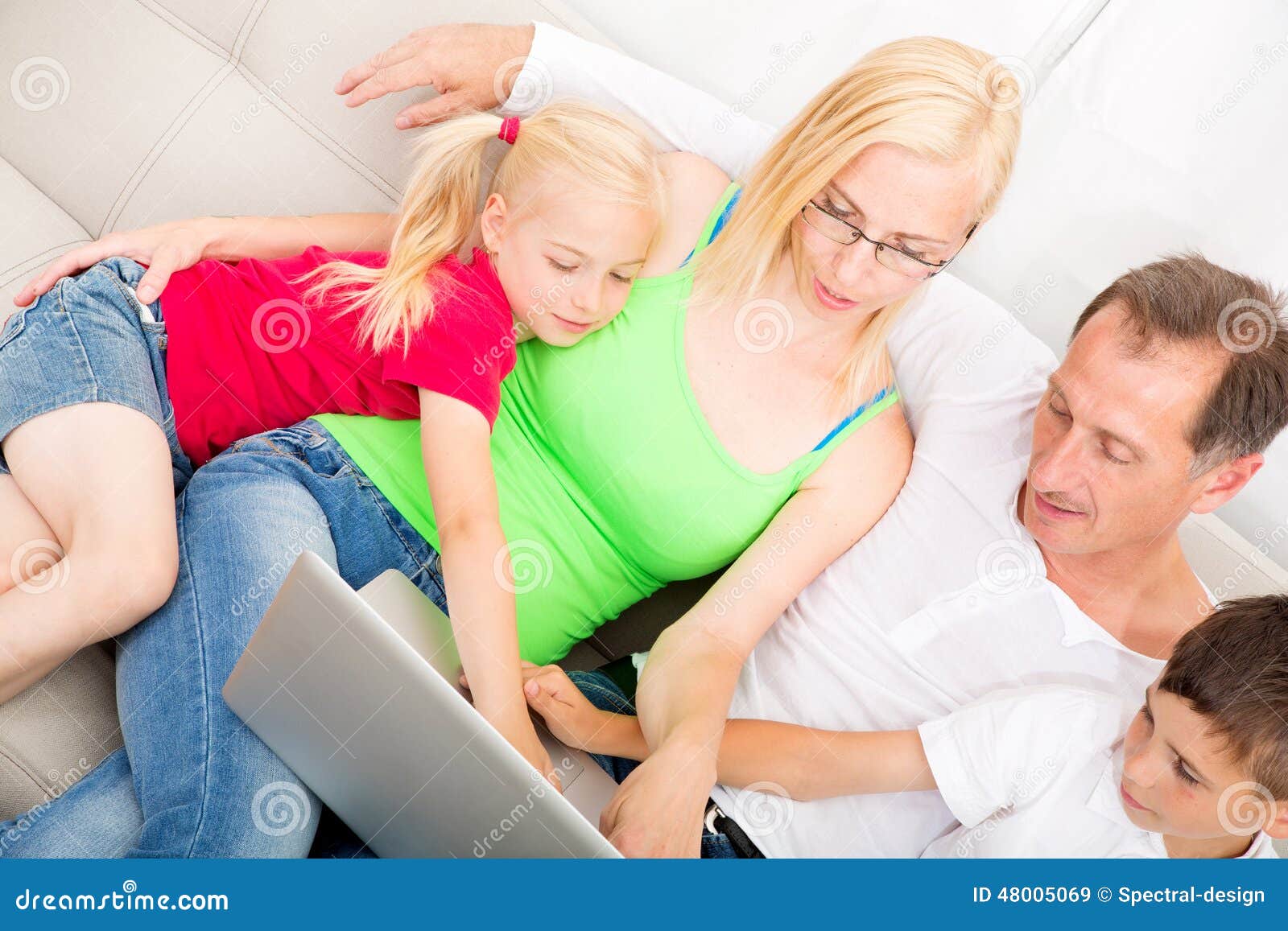 Happy family on the couch stock image. Image of cheerful - 48005069
