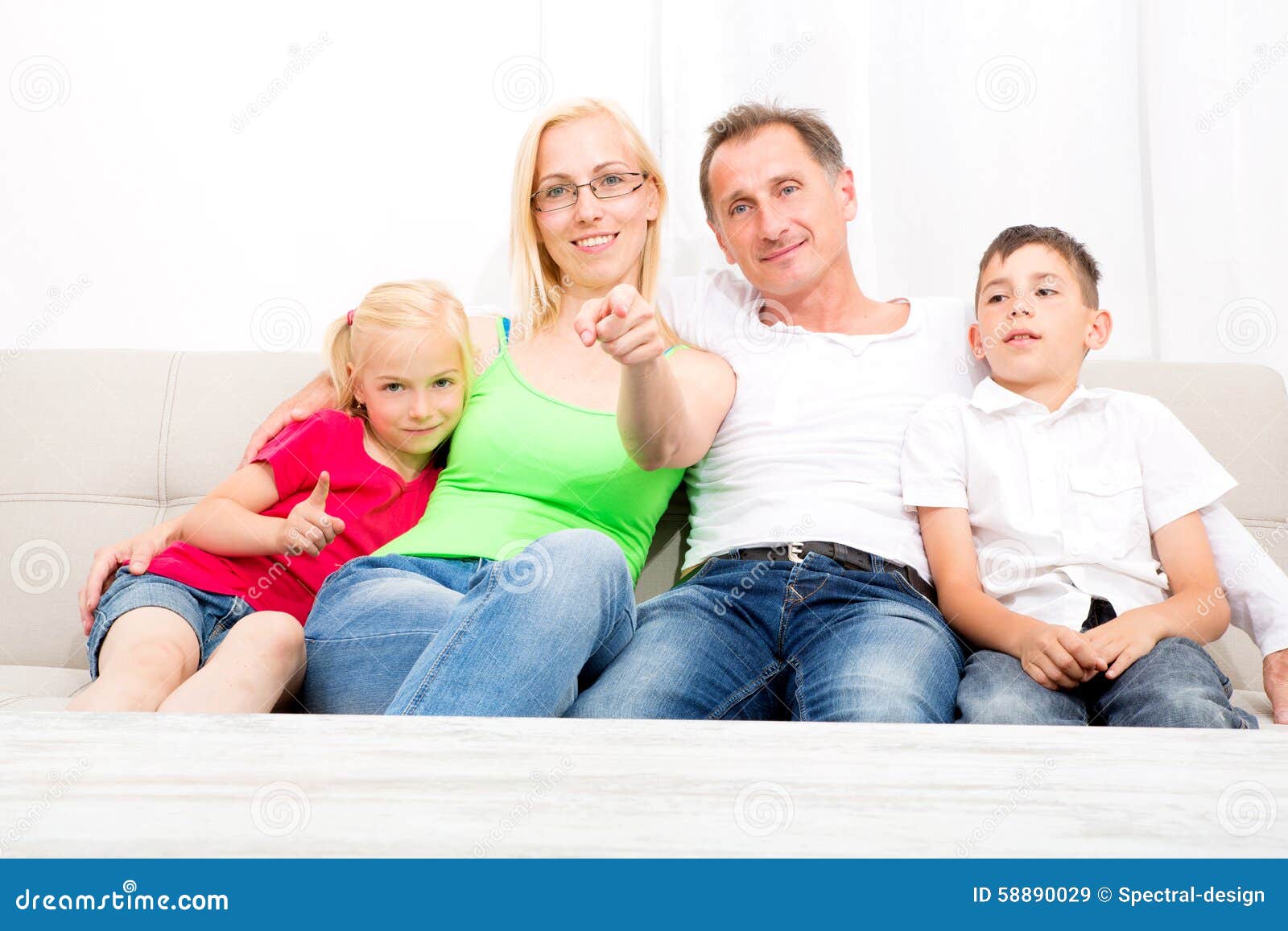 Happy family on the couch stock image. Image of female - 58890029
