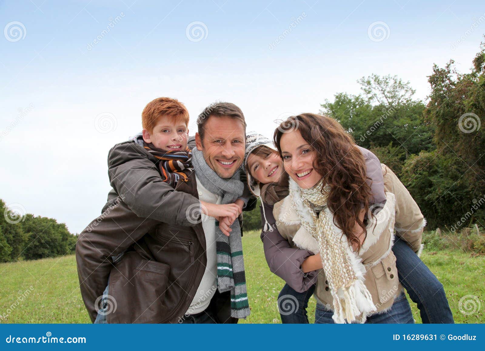 Happy Family in Countryside Stock Image - Image of field, parents: 16289631
