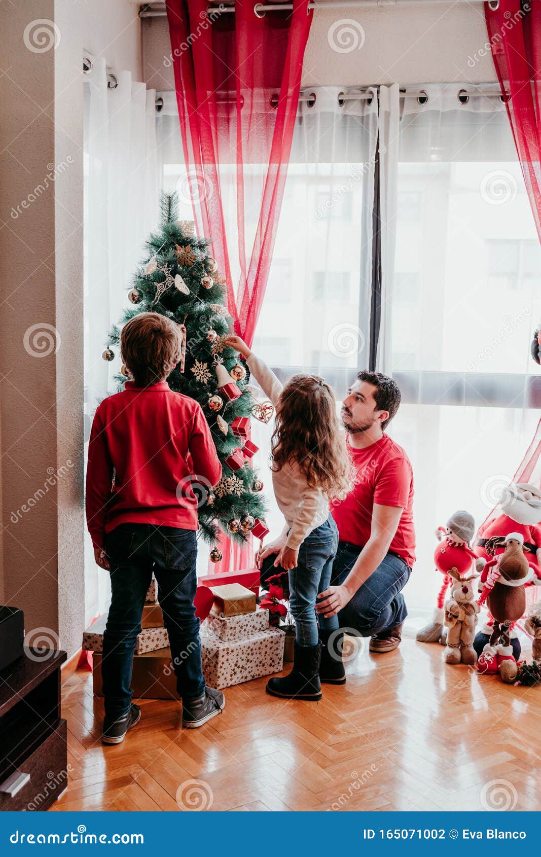 Happy Family Decorating Christmas Tree at Home Stock Photo - Image of ...