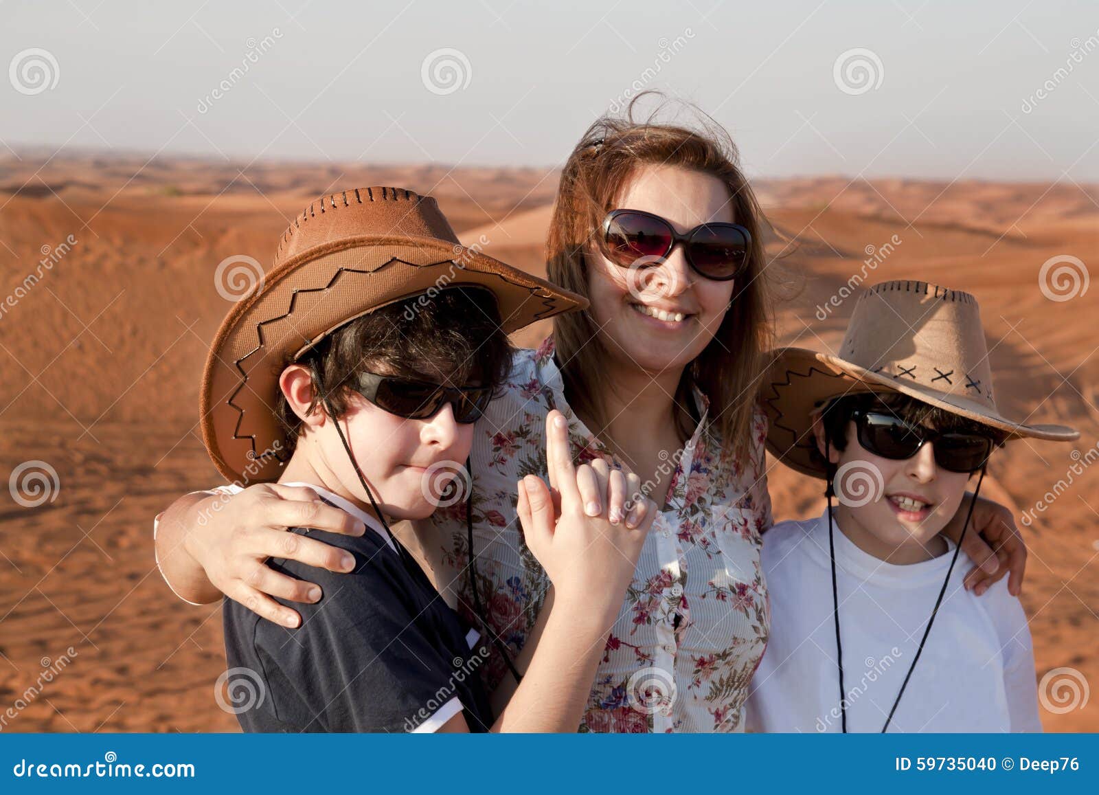 Happy family in a desert stock photo. Image of sunset - 59735040