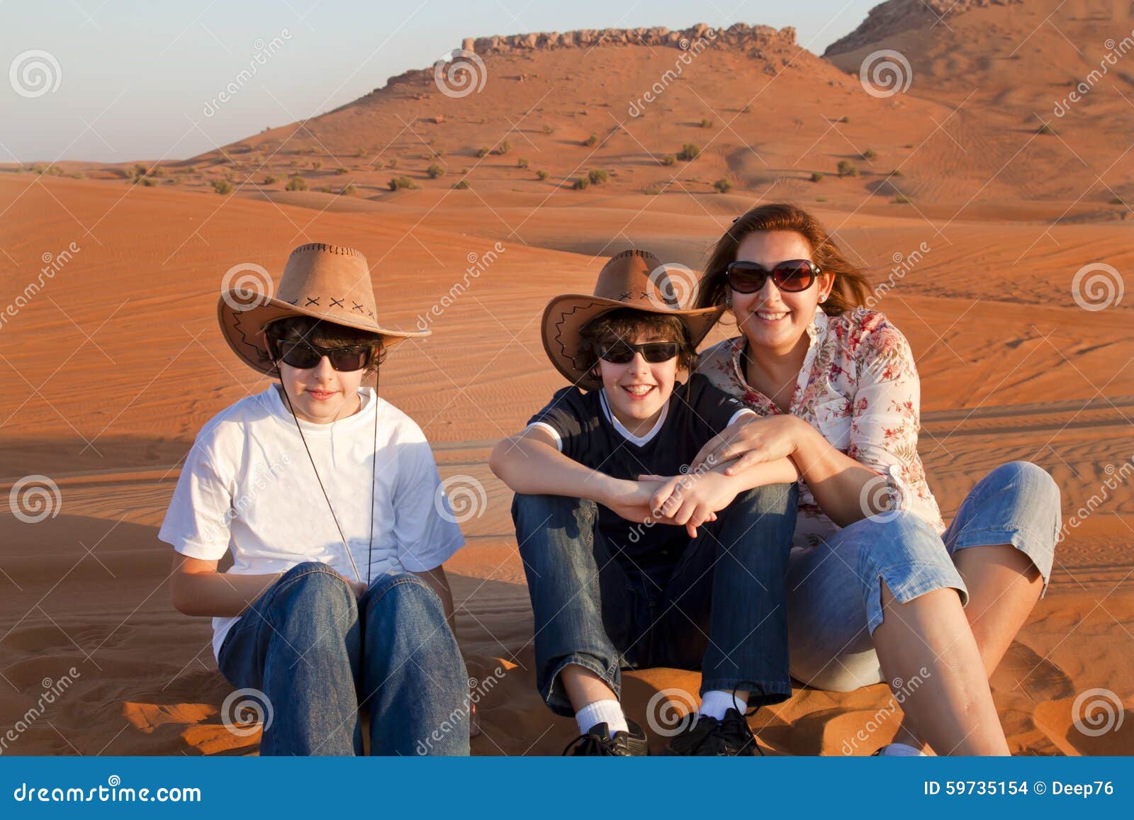 Happy family in a desert stock photo. Image of looking - 59735154