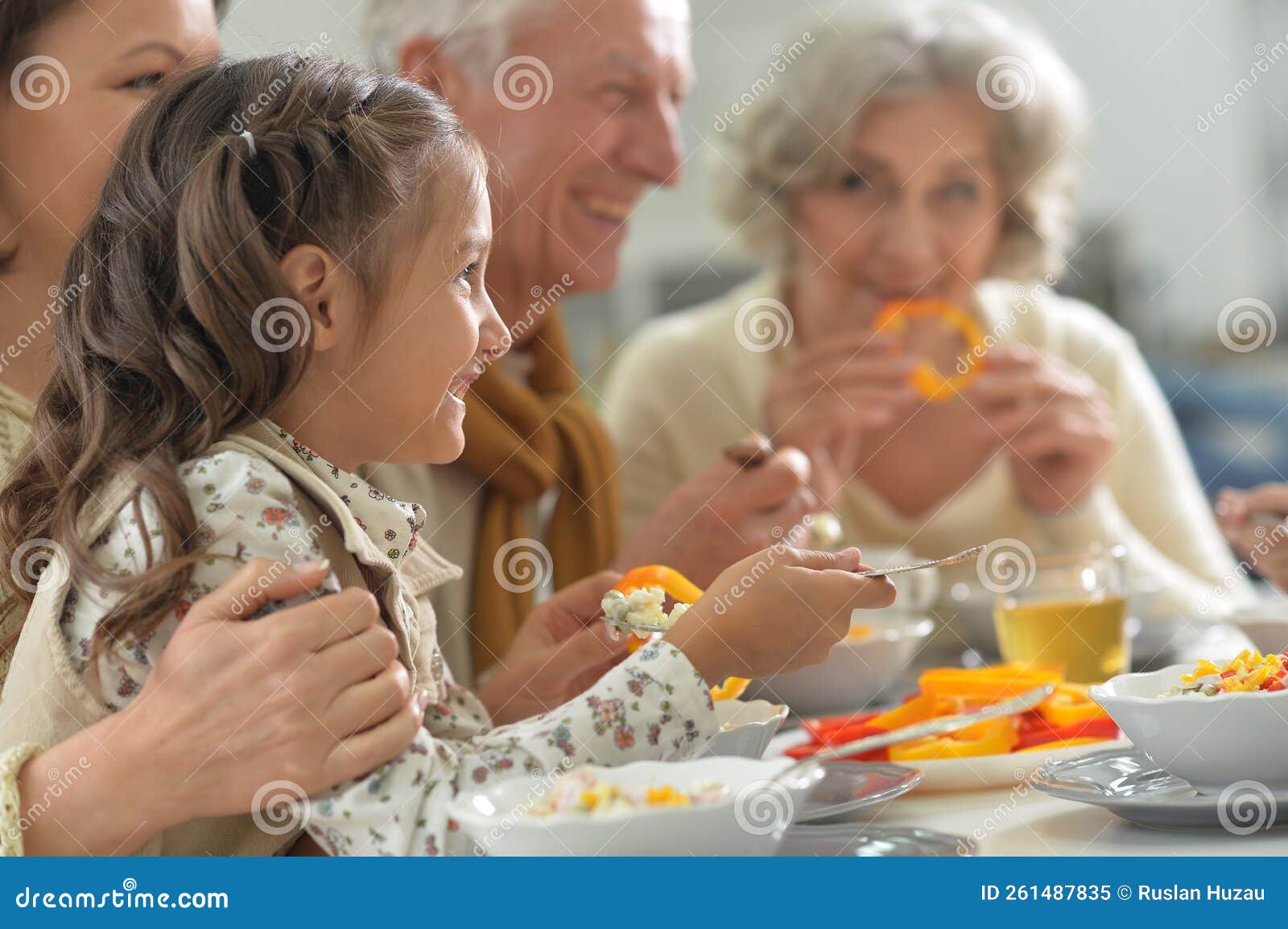 Happy Family of Different Generations Eating Together Stock Image ...
